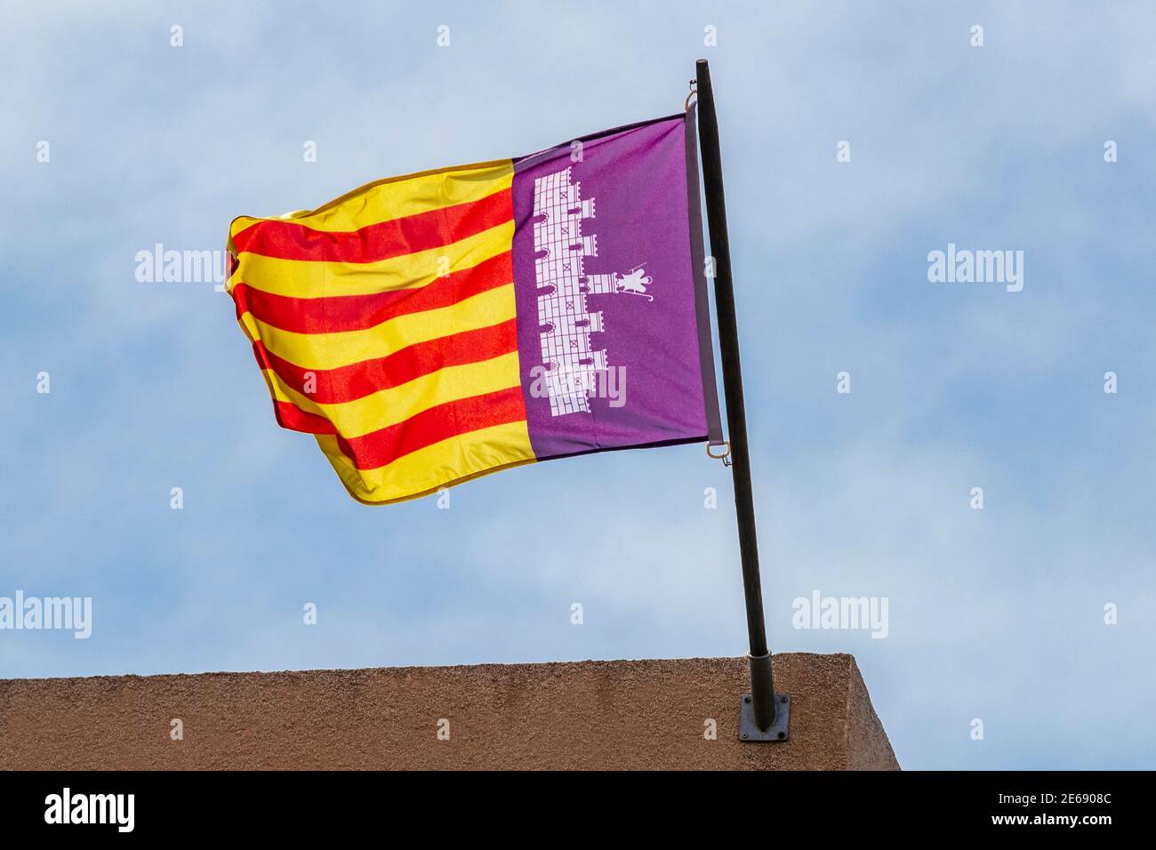 Mallorcan flag in Mallorca Spain. Purple yellow red Stock Photo - Alamy