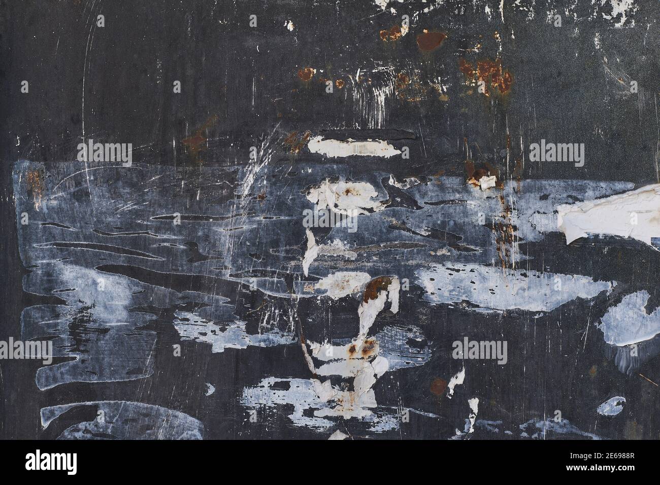 Plate of metal rusty texture with traces of black paint faint color ...