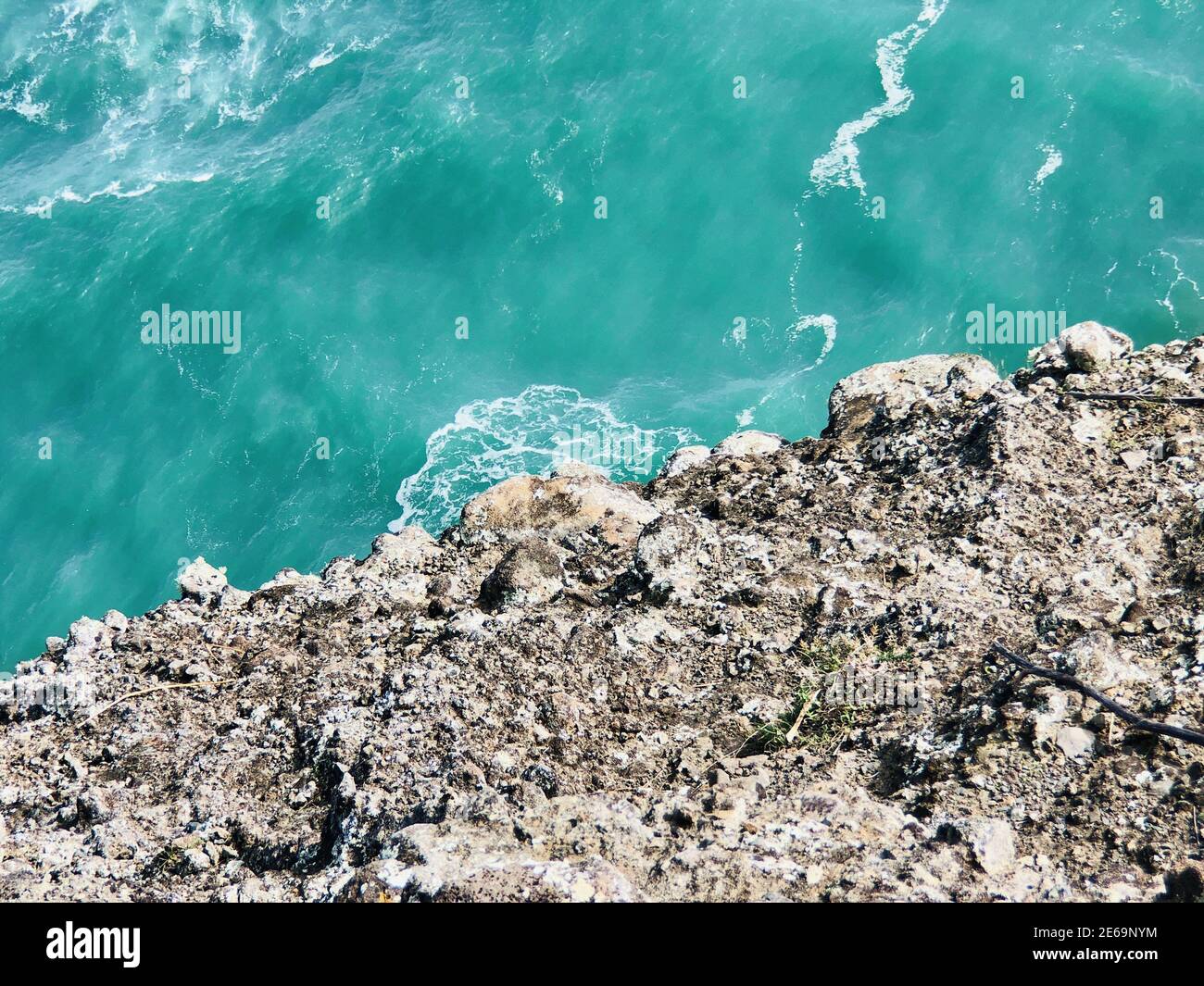 Overhead view of the sea waves meet the rocky shore - perfect for the ...