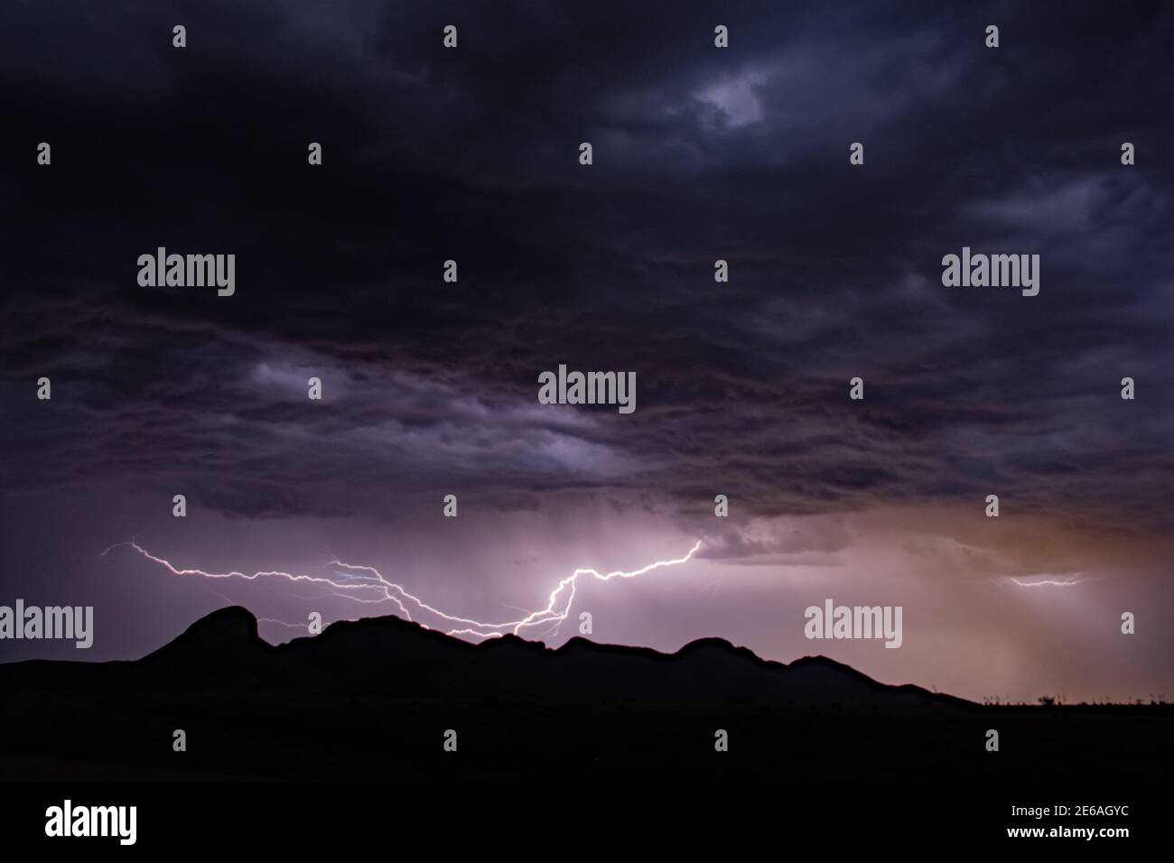 Lightning over the Mustang Mountains Stock Photo - Alamy