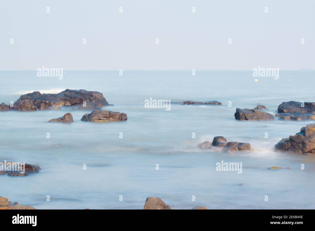 Boulders and stone laying in shallow water (sea Stock Photo - Alamy