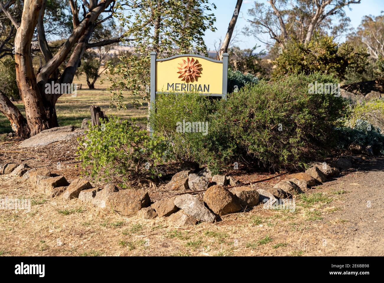 A Meridian welcome sign in a Native Australian shrubs in a Landscaped ...