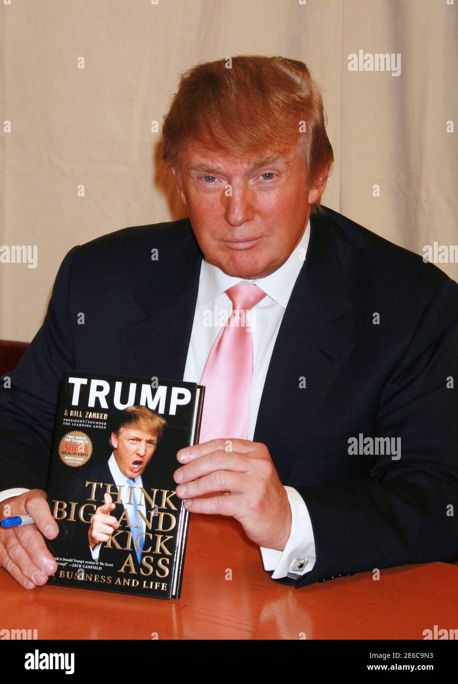 Donald Trump signing copies of his new book "Think Big and Kick Ass in ...