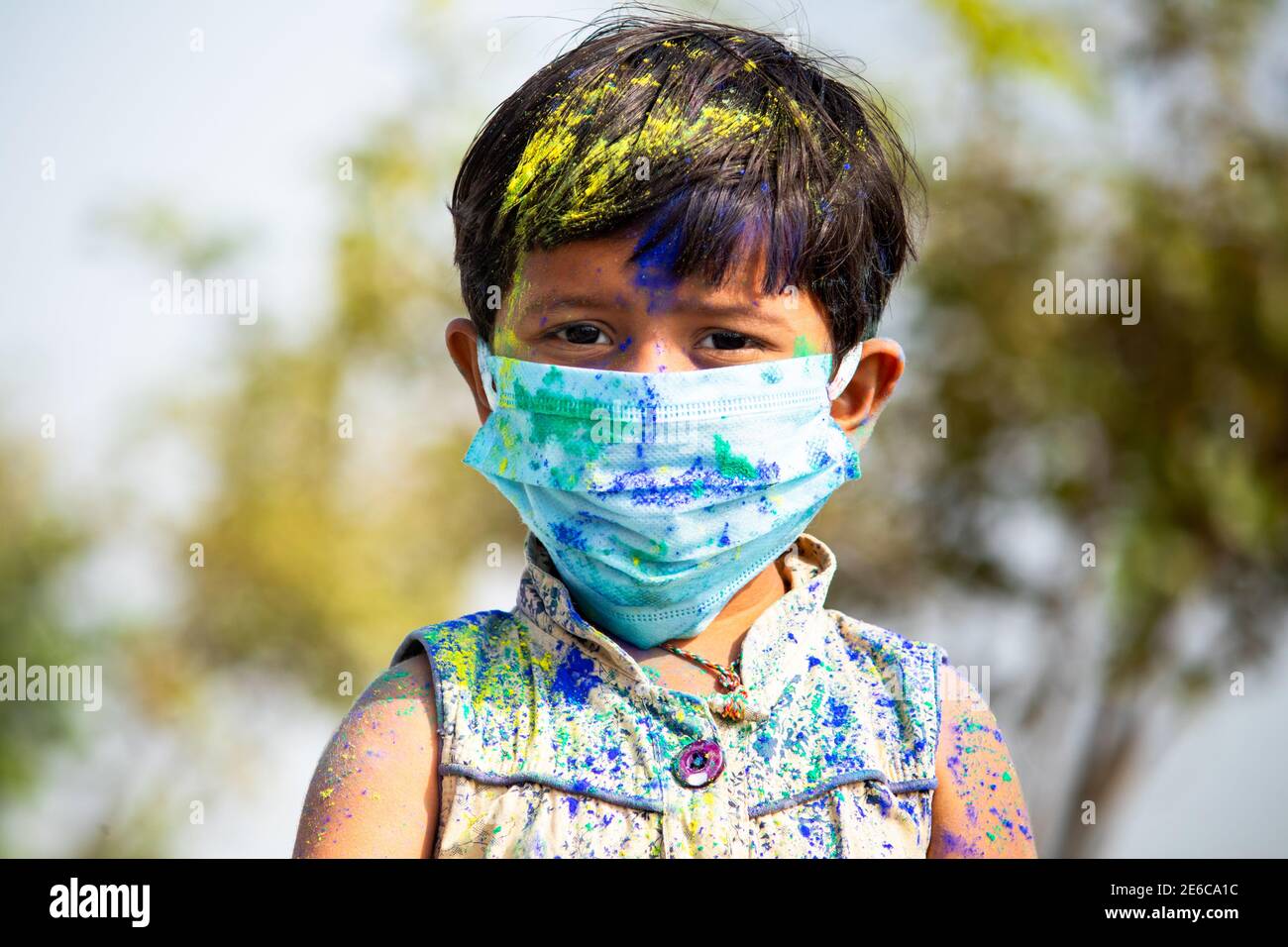 Portrait of young cute little girl kid with medical face mask with ...