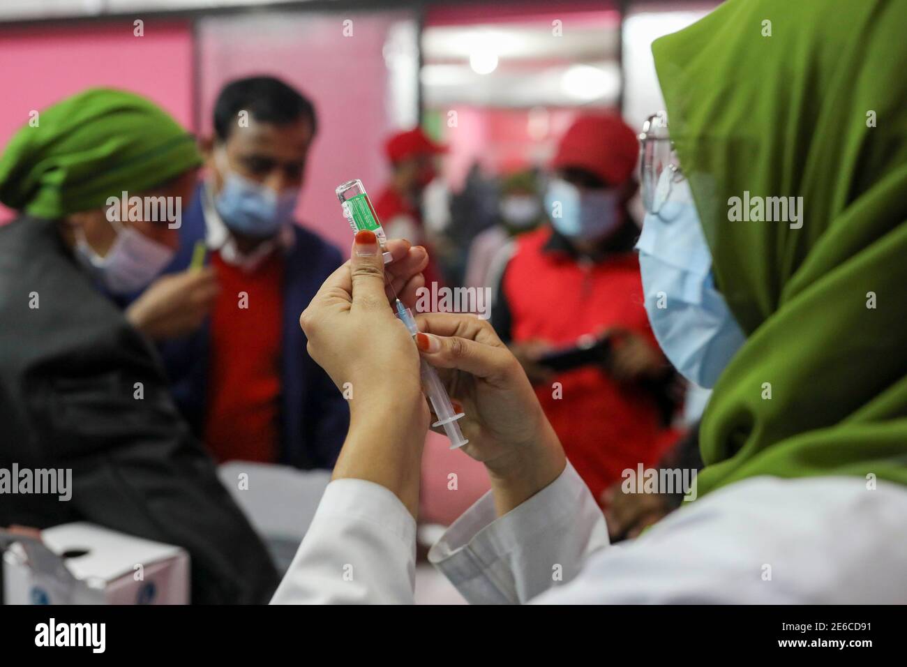 Dhaka, Bangladesh. 28th Jan, 2021. A medical worker prepares to ...