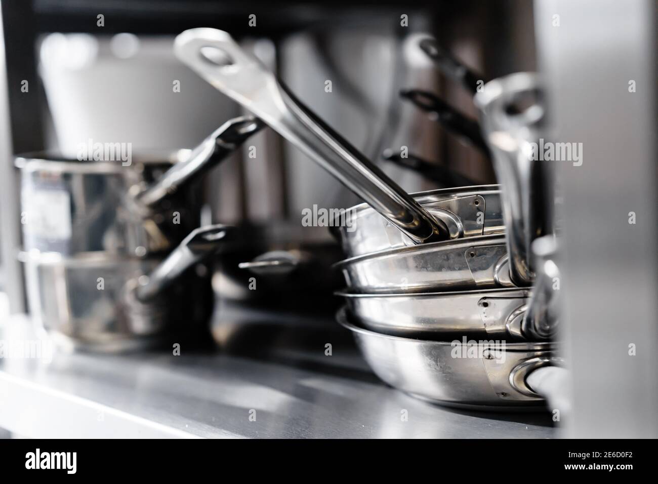 Kitchen utensils on work surface in professional kitchen Stock Photo ...
