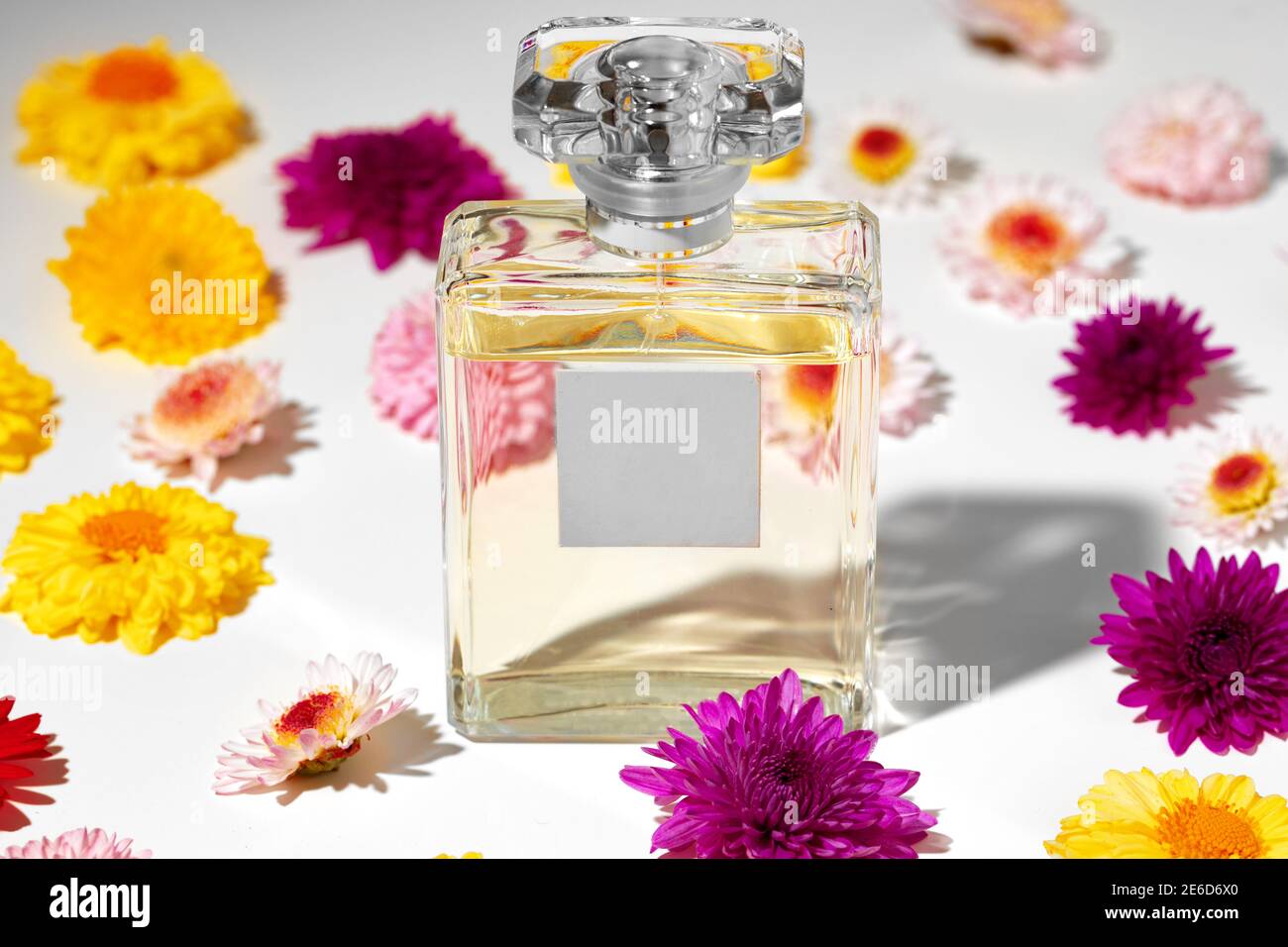 Perfume bottle for women in flower buds Stock Photo - Alamy