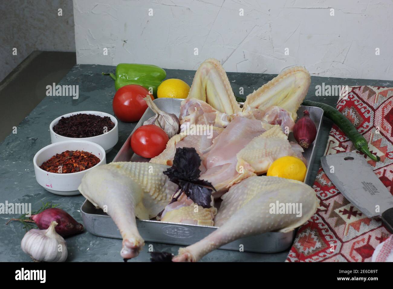 A butcher wrapping a piece of pork meat on a counter Stock Photo - Alamy
