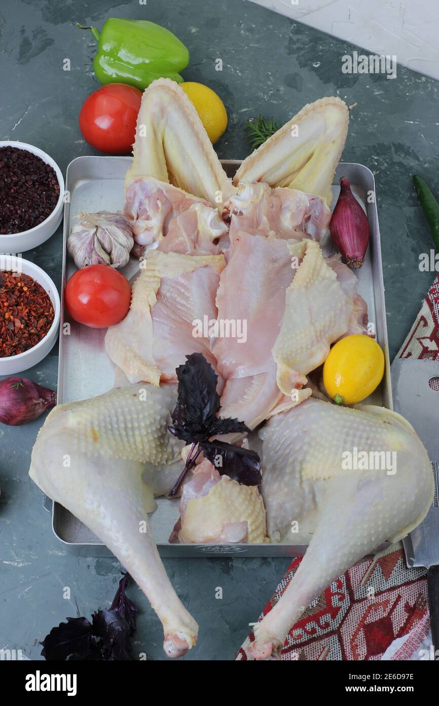 A butcher wrapping a piece of pork meat on a counter Stock Photo - Alamy
