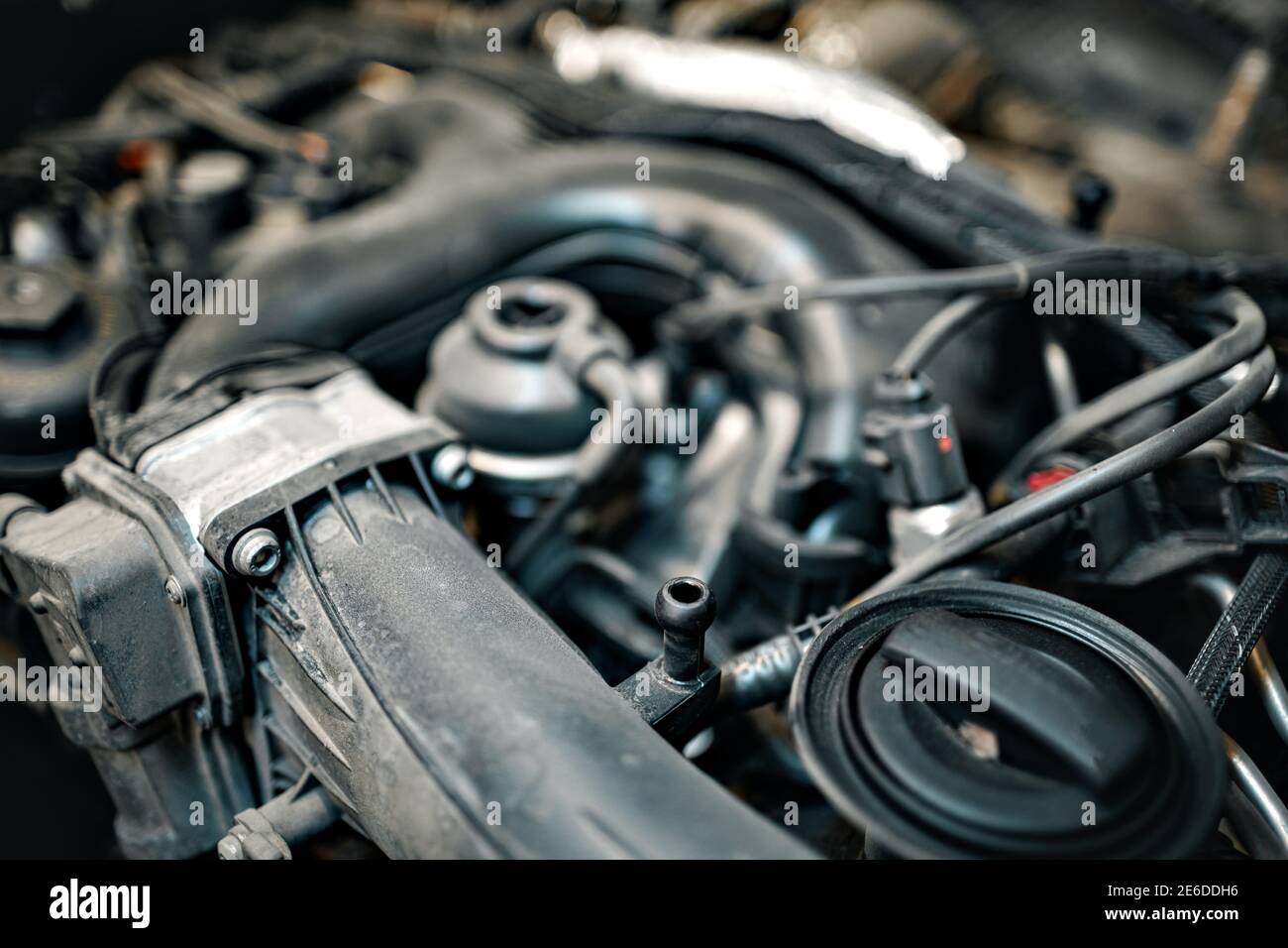 Dirty engine under the hood of a car Stock Photo - Alamy