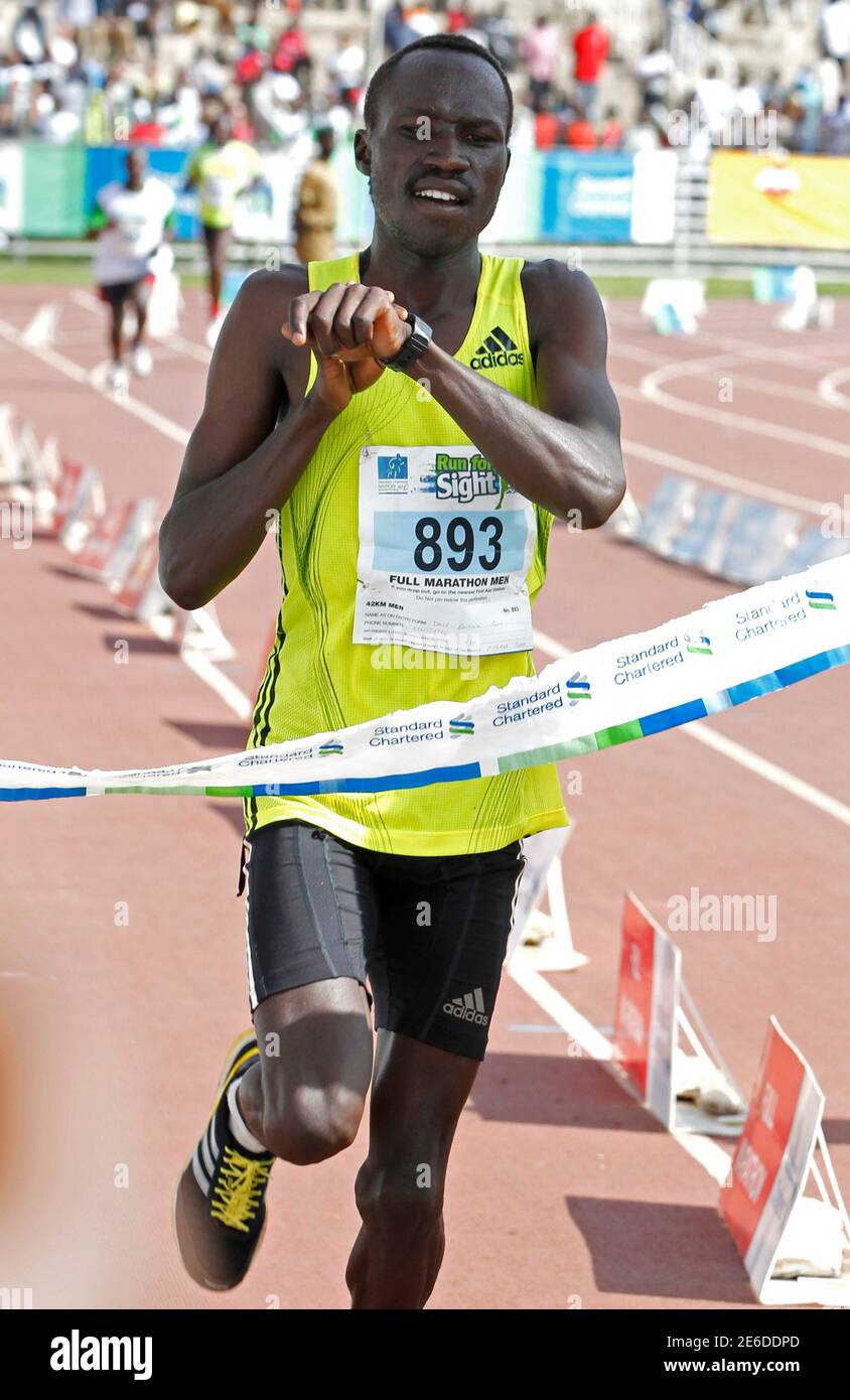 Runner crosses finish line in hi-res stock photography and images - Alamy