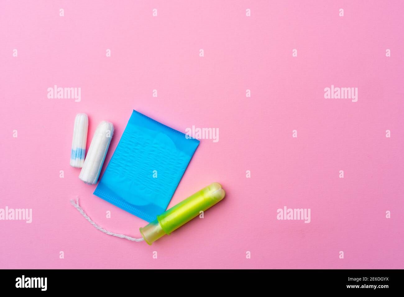 Female hygienic pad and tampons on pink background Stock Photo - Alamy