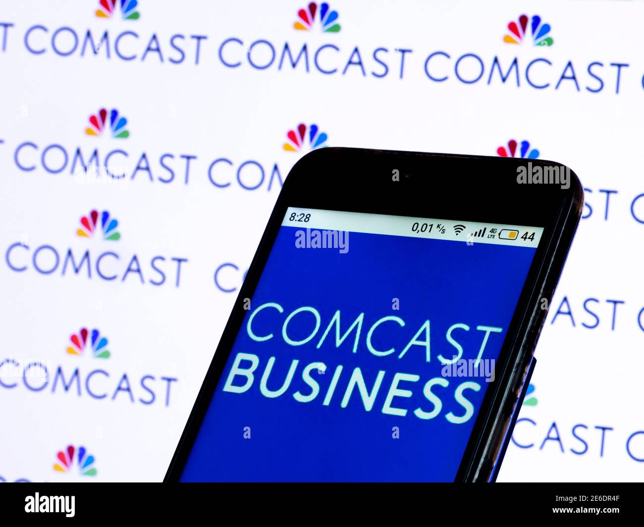 In this photo illustration a Comcast Business logo seen displayed on ...