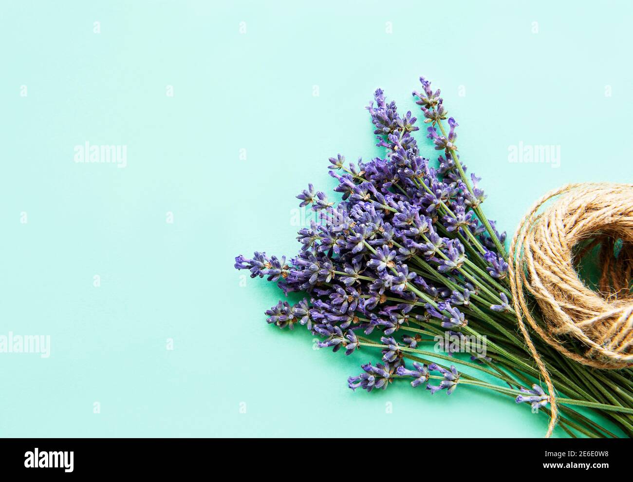Beautiful natural lavender flowers bouquet tied with rope over ligth ...