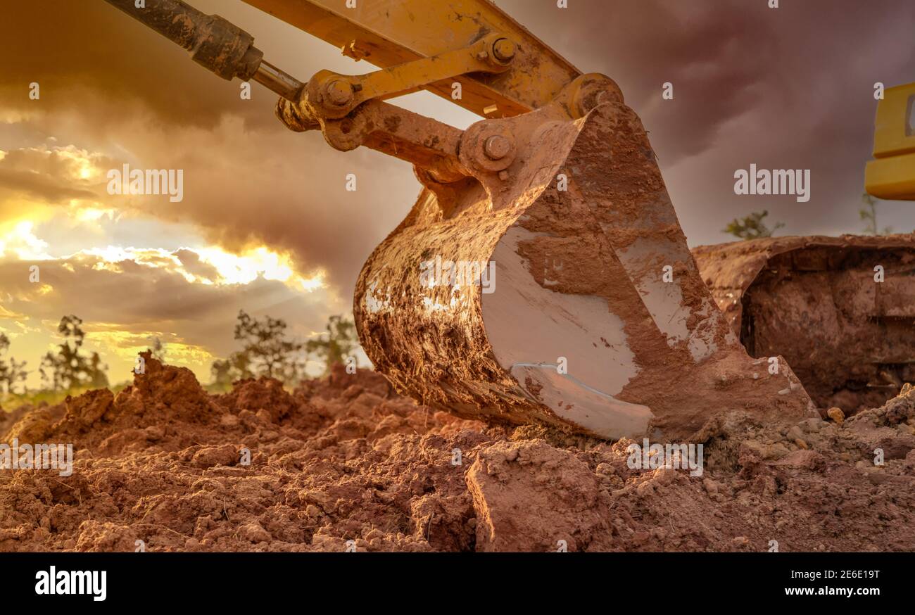 Dirt metal bucket of backhoe after digging soil. Backhoe parked at ...
