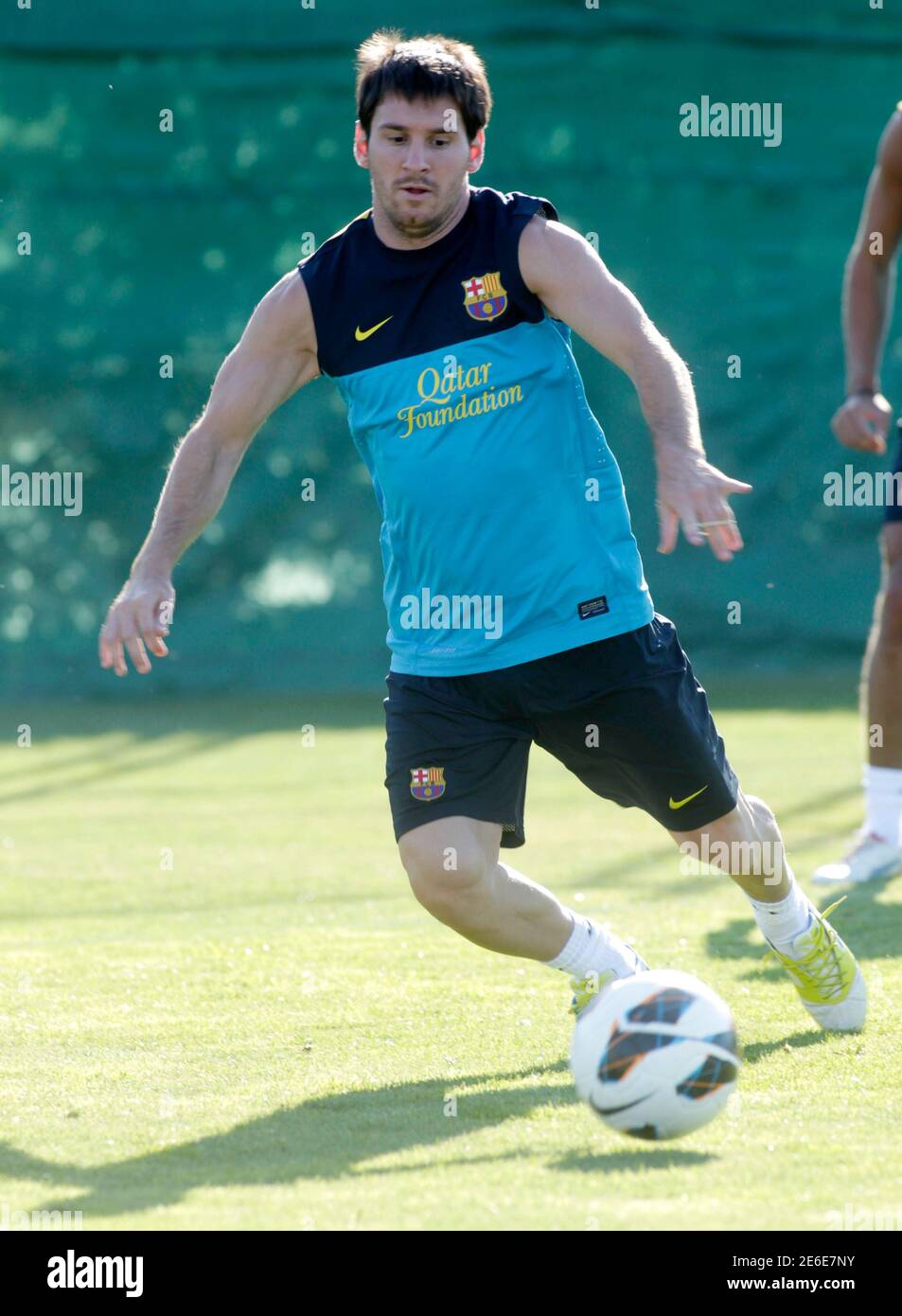 Barcelonas lionel messi attends training hi-res stock photography and ...