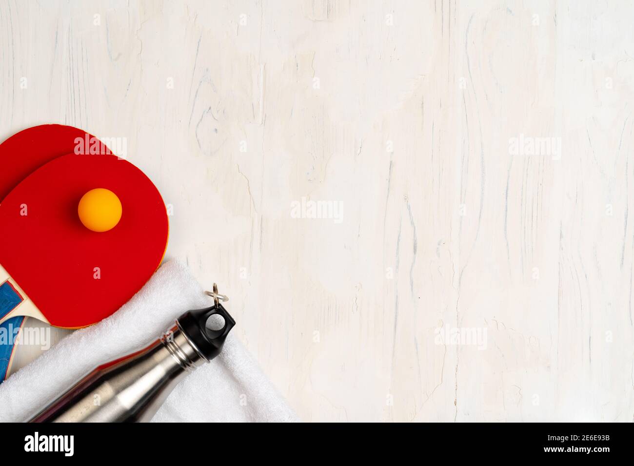 Ping pong equipment. Two rackets and ball, top view Stock Photo - Alamy