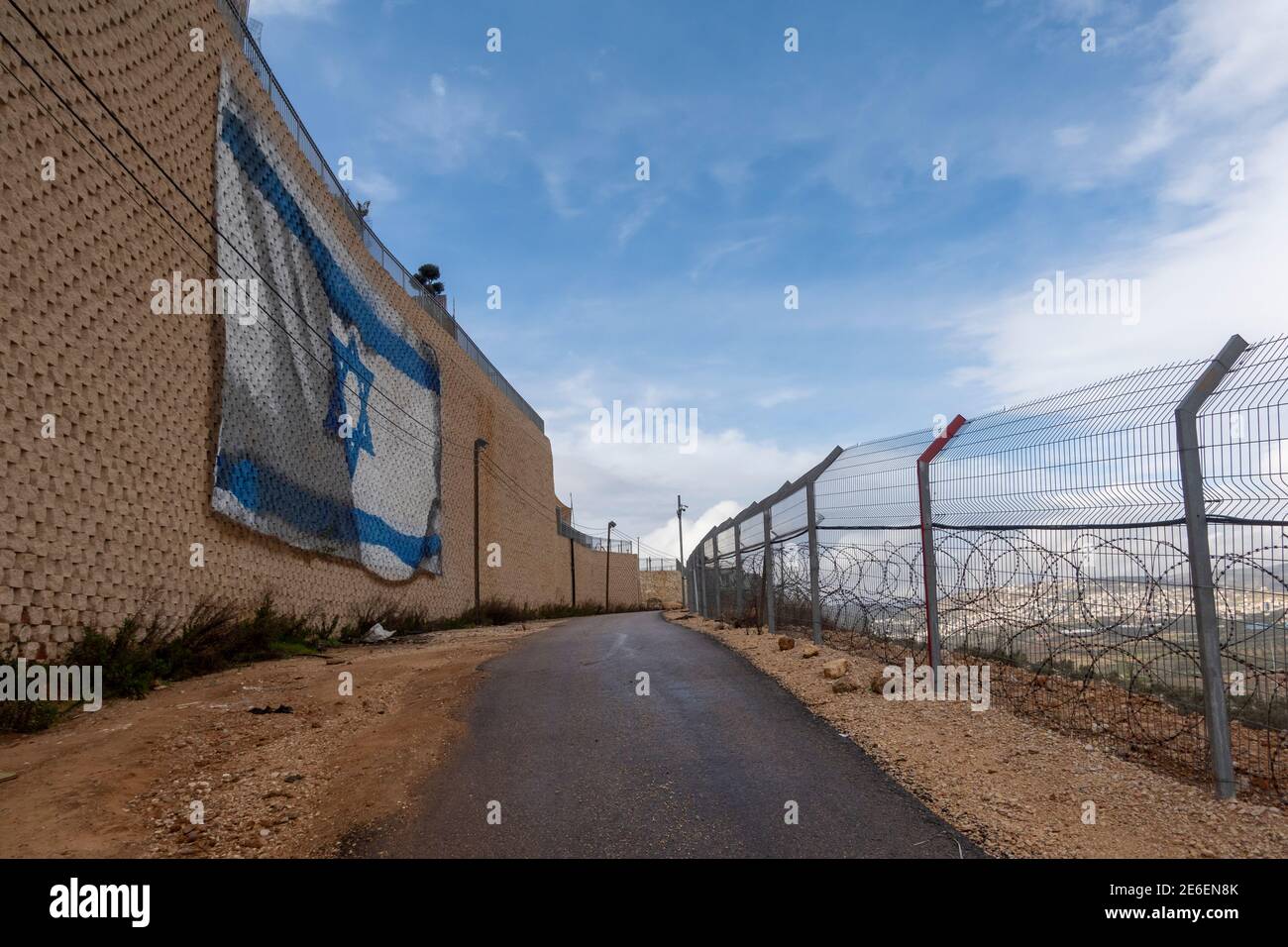 A large Israeli flag painted in a wall at the Jewish settlement of ...