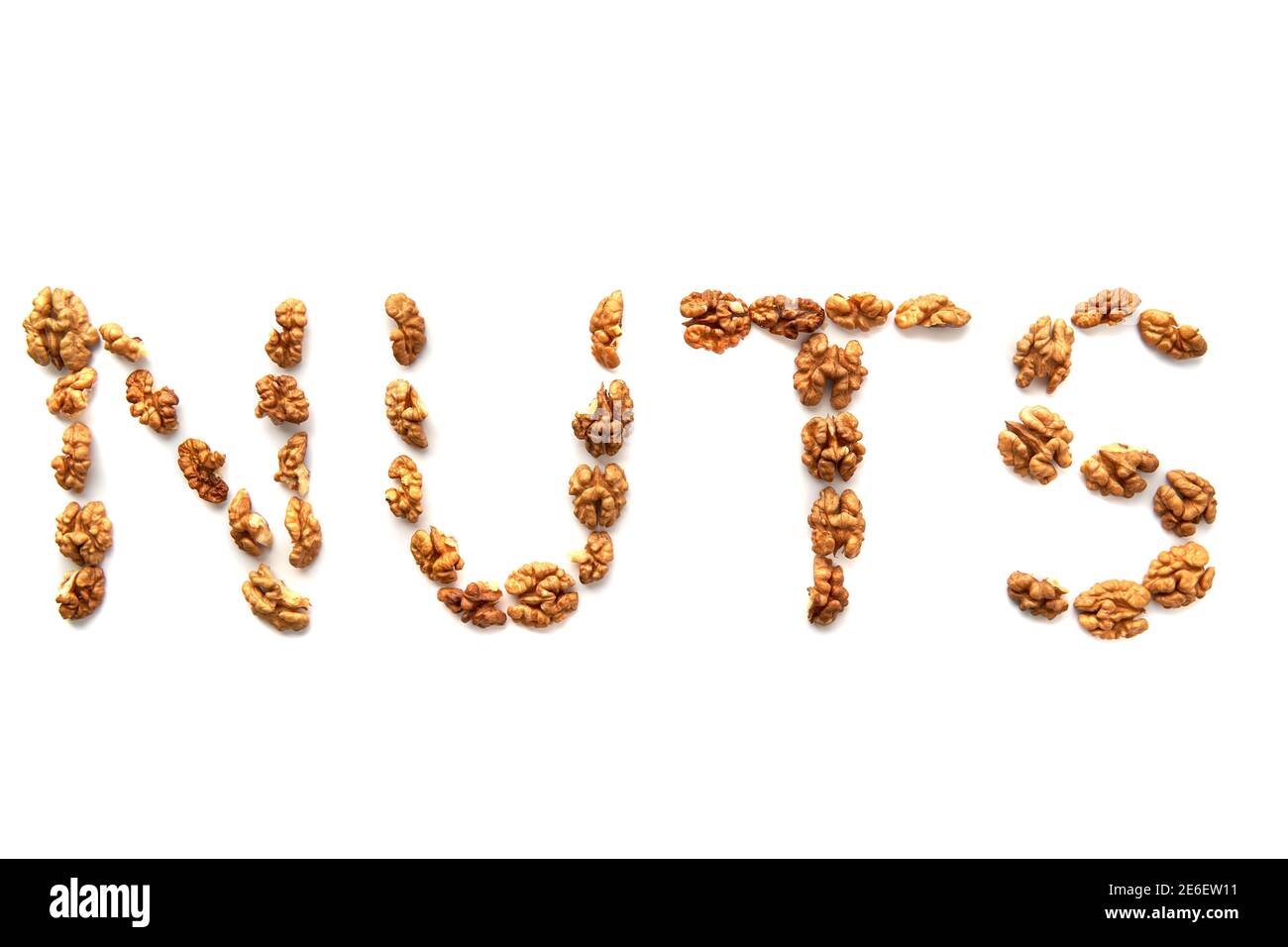 Word NUTS written in walnuts on white background Stock Photo - Alamy