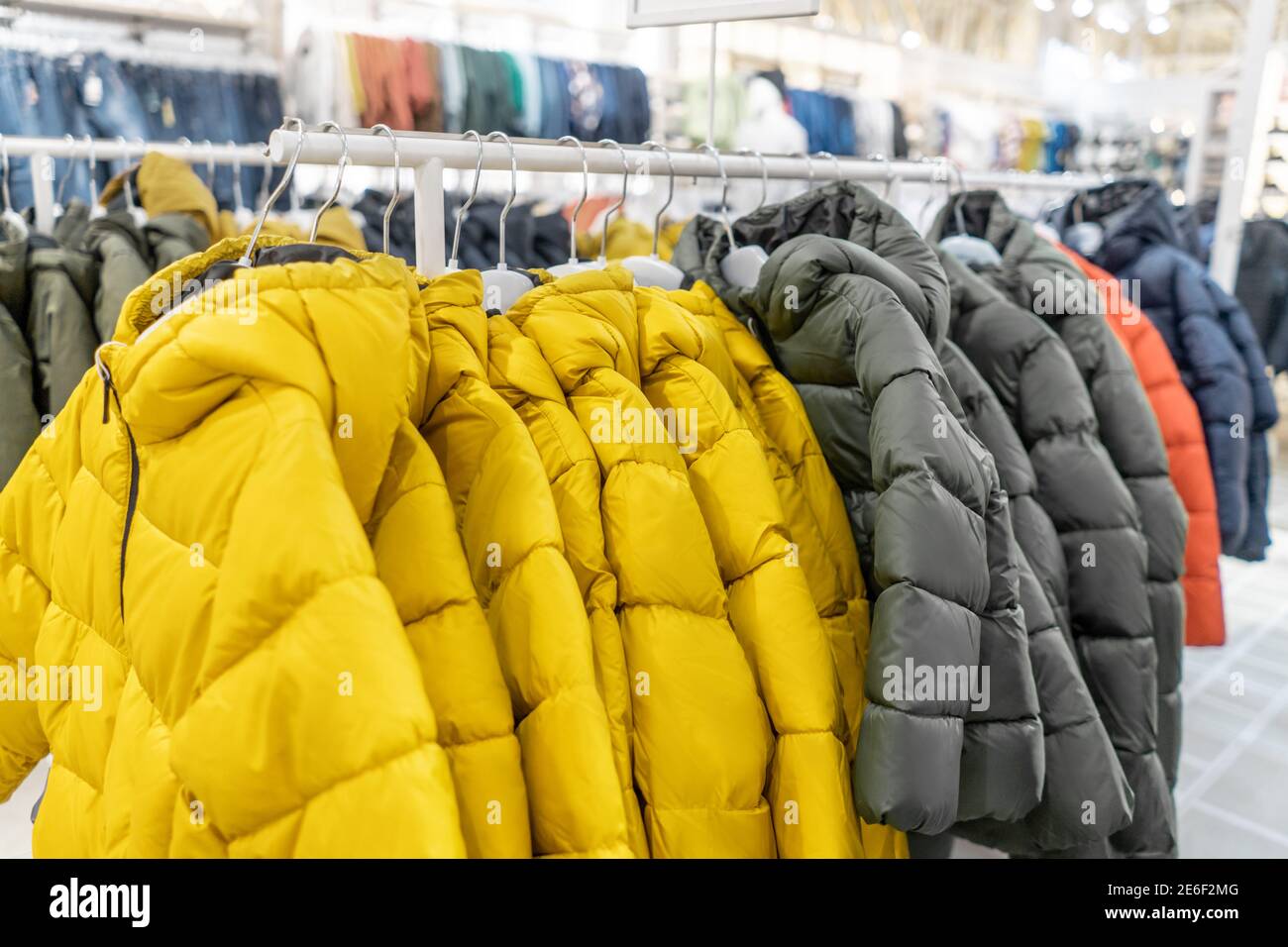 row of winter gray and yellow jackets, 30 percent discount Stock Photo ...