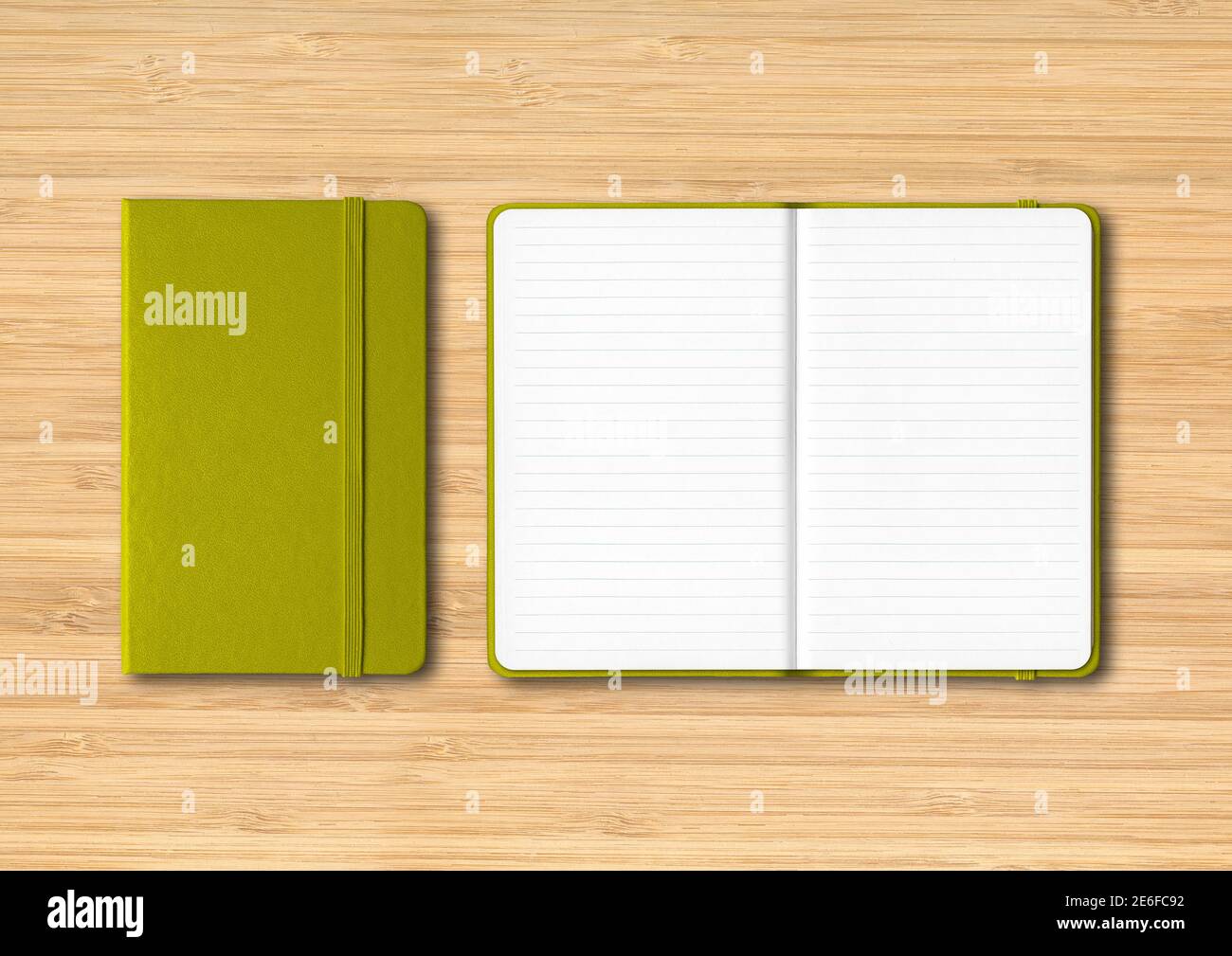 Olive green closed and open lined notebooks mockup isolated on wooden ...