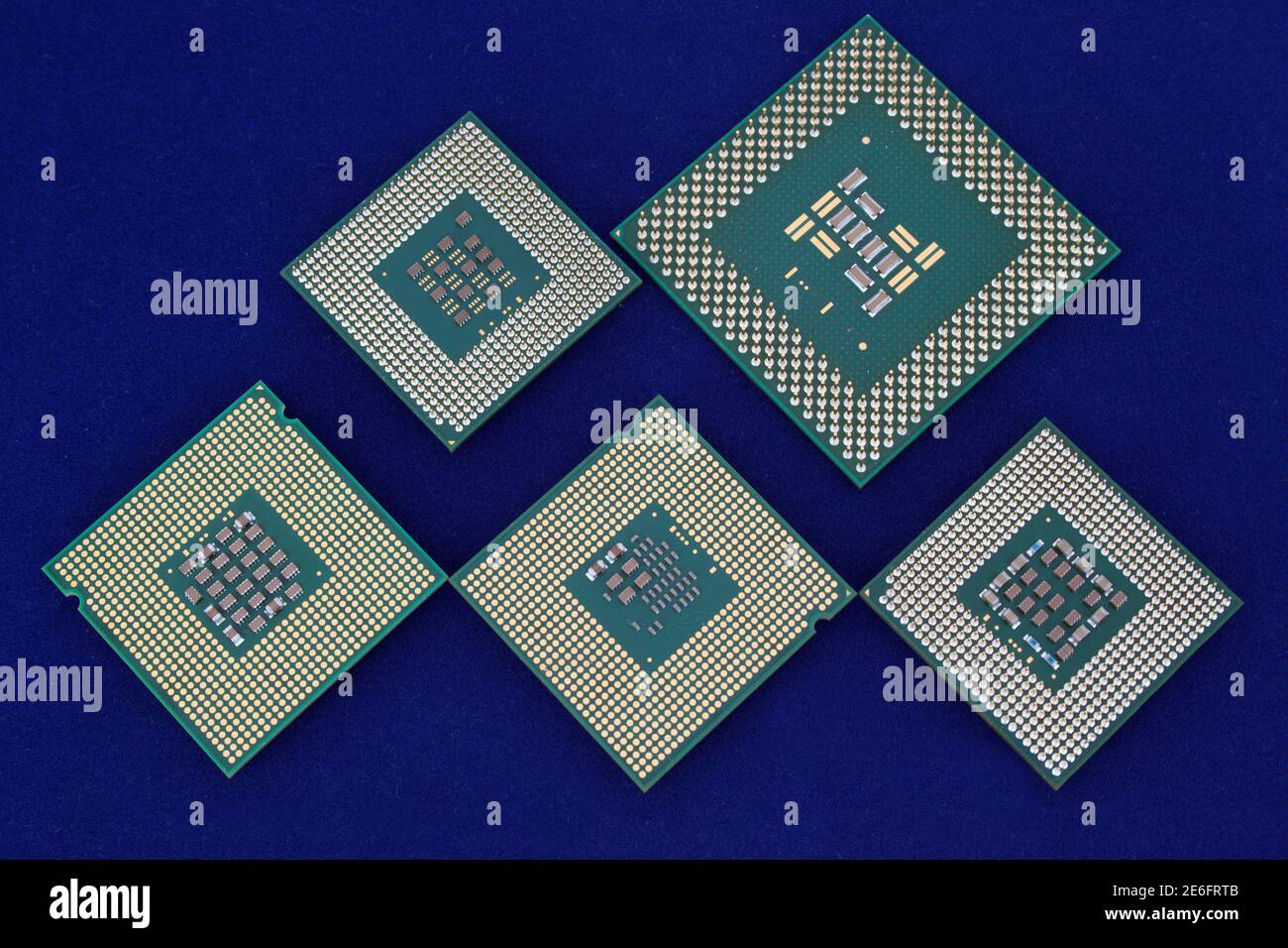 Five computer chips on the blue background. Closeup. Retro technology ...