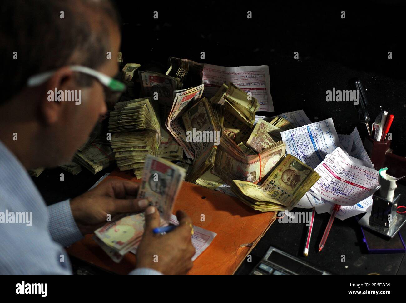 Indian bank cashier hi-res stock photography and images - Alamy