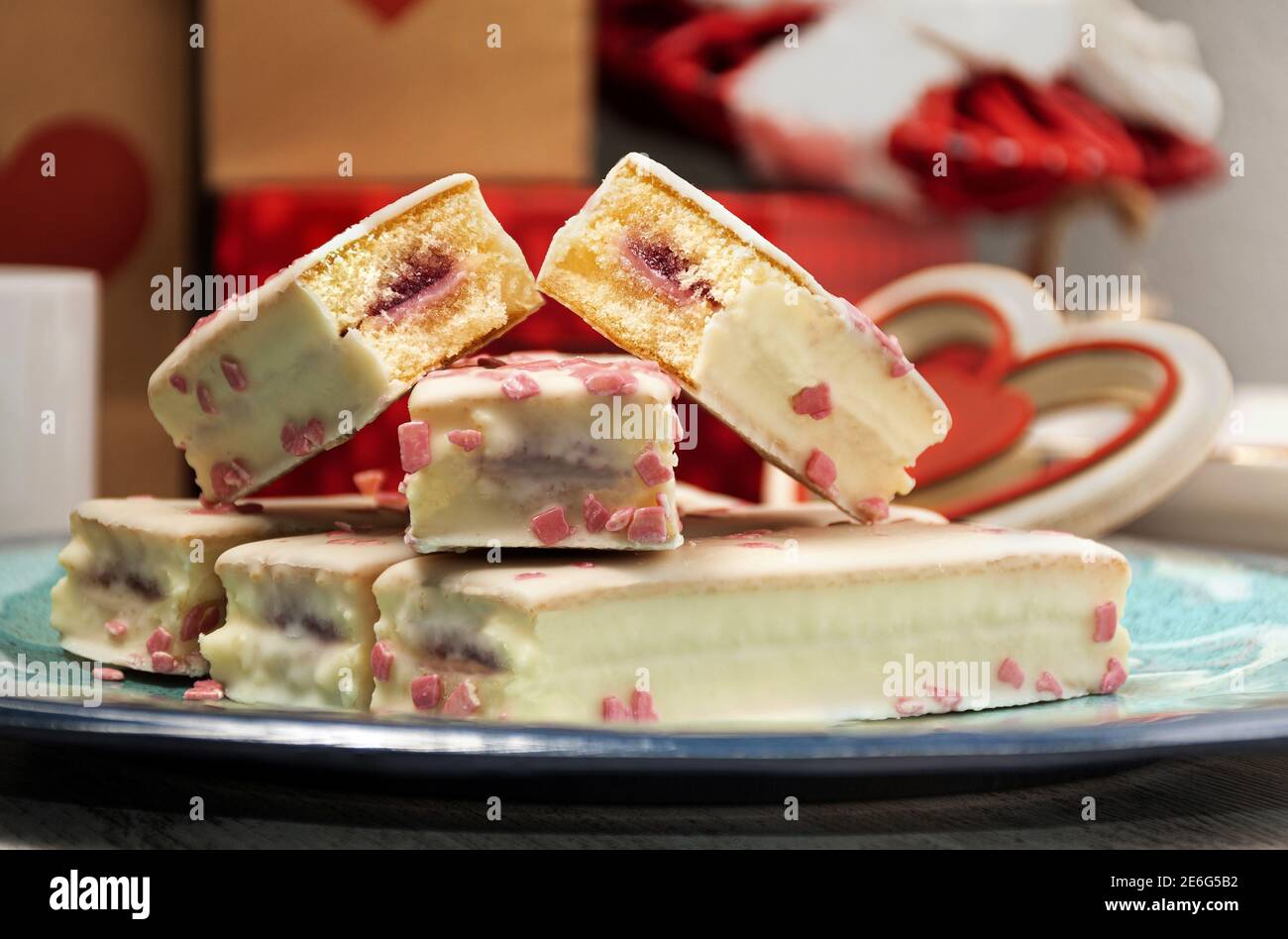 Biscuit cakes with raspberry filling and white chocolate topping Stock ...