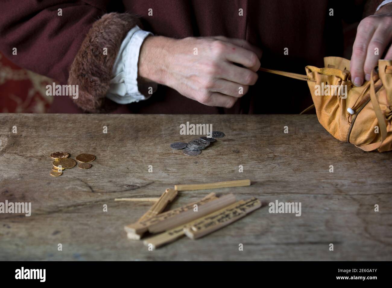 Medieval merchant counting money using tally sticks Stock Photo - Alamy