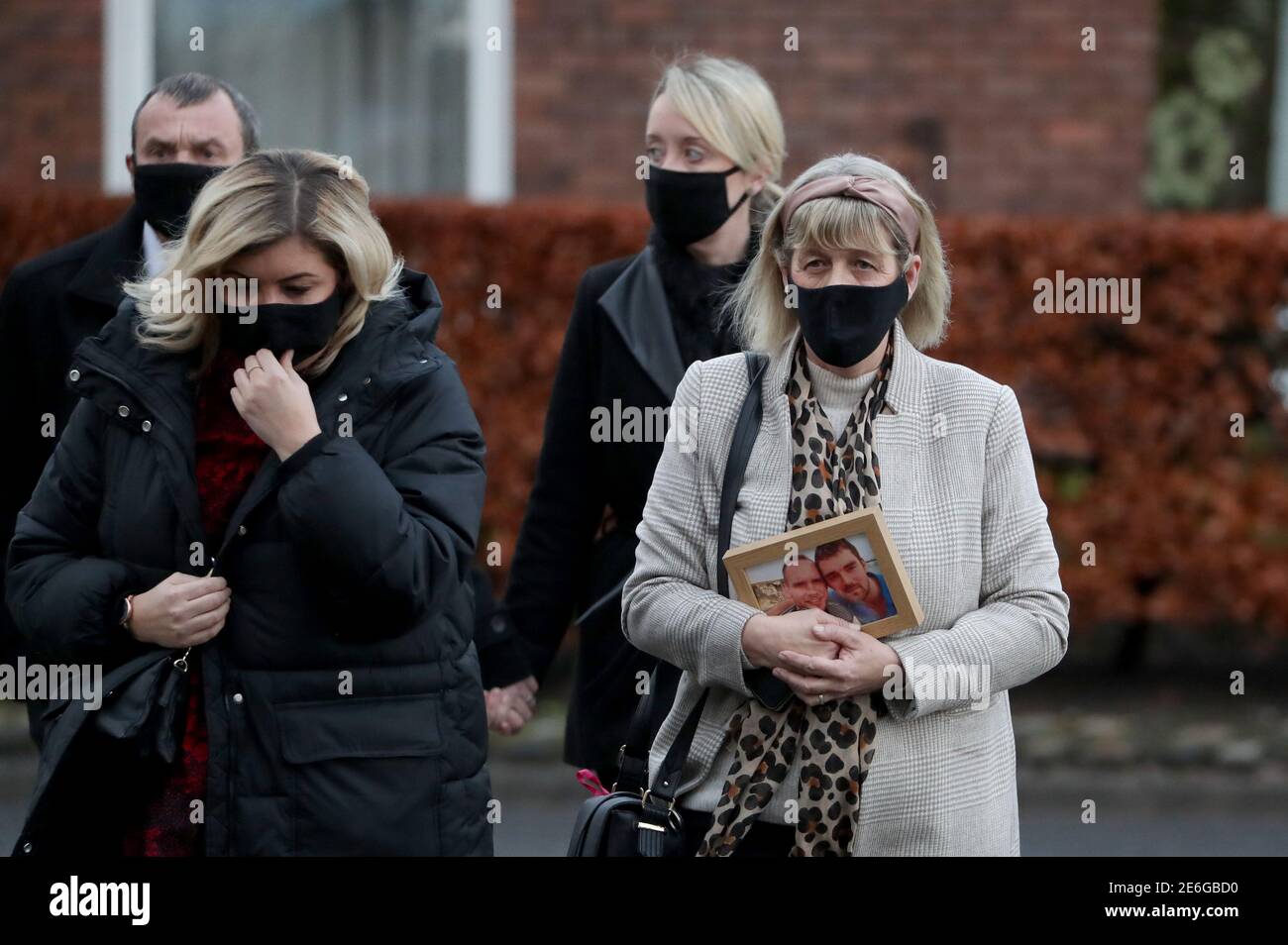 Jane Midgley (right), the mother of victim Simon Midgley, arrives with ...
