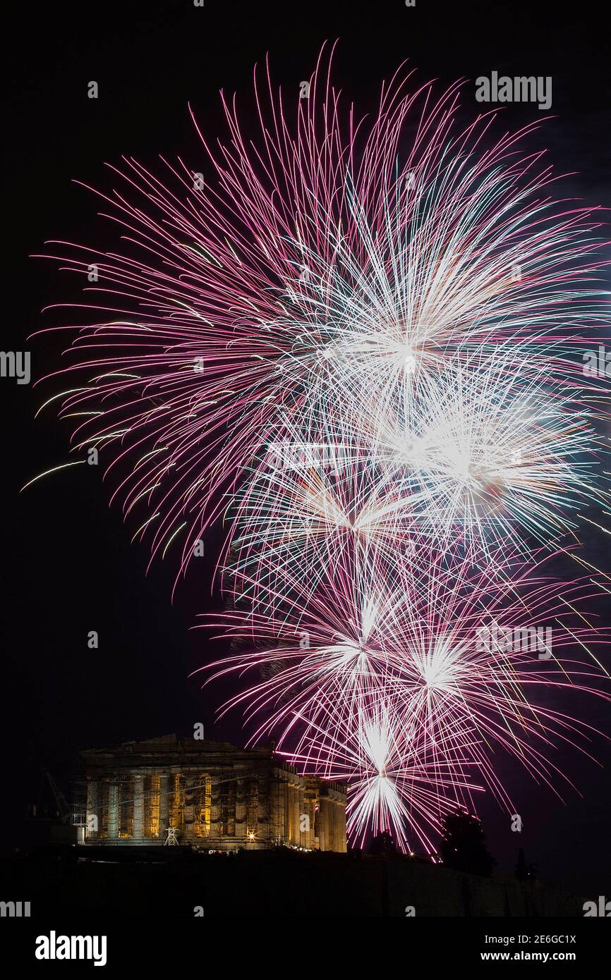 Fireworks explode over the ancient parthenon temple at the acropolis hi ...