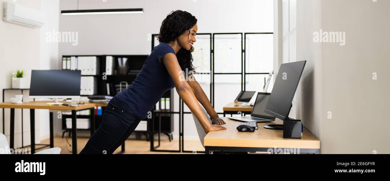 African American Doing Office Exercise Workout Training Stock Photo - Alamy