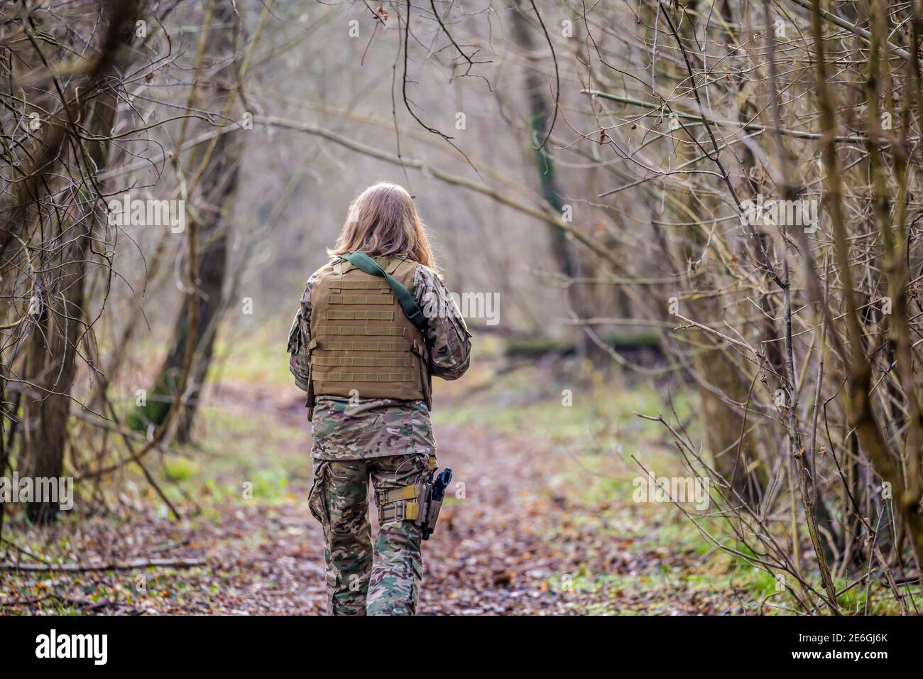 Girl walking with gun hi-res stock photography and images - Alamy