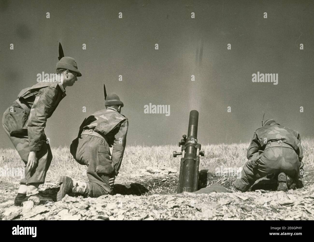 Italian Army Alpini shooting with the mortar, 1960s Stock Photo - Alamy