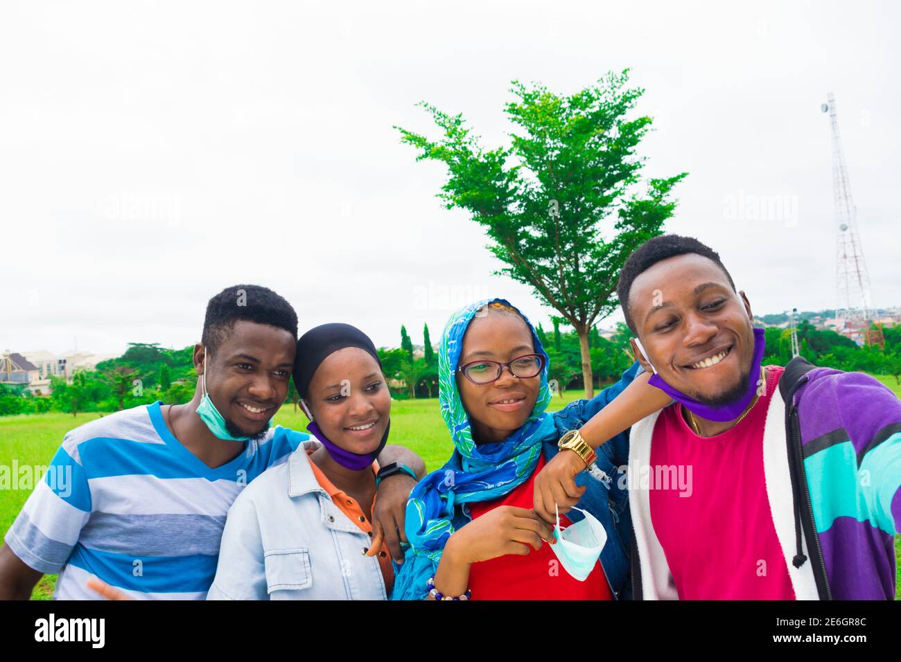 young black friends standing in a park and taking a selfie from the ...