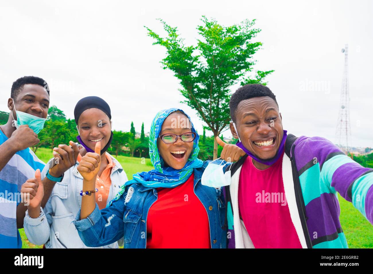 young black friends standing in a park and taking a selfie from the ...