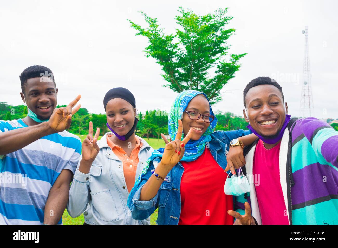young black friends standing in a park and taking a selfie from the ...
