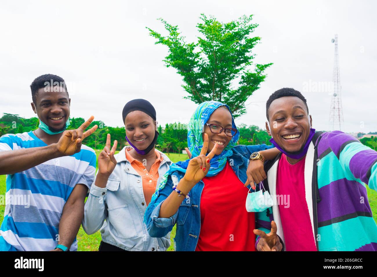 young black friends standing in a park and taking a selfie from the ...
