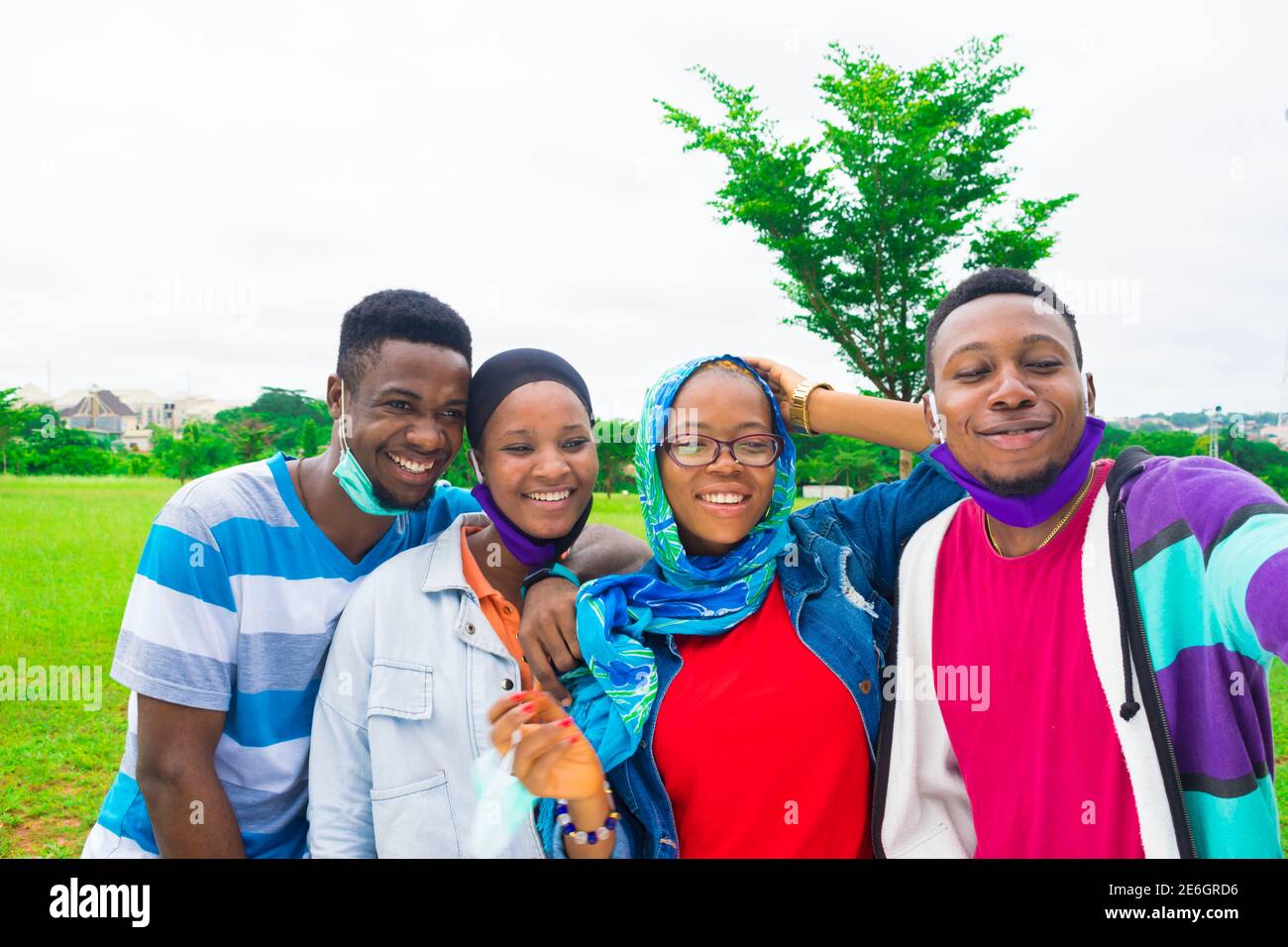 young black friends standing in a park and taking a selfie from the ...