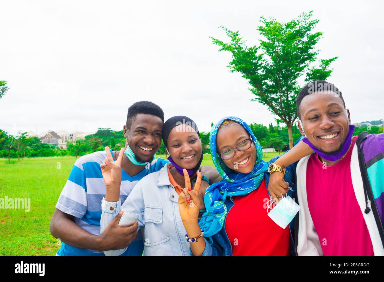 young black friends standing in a park and taking a selfie from the ...