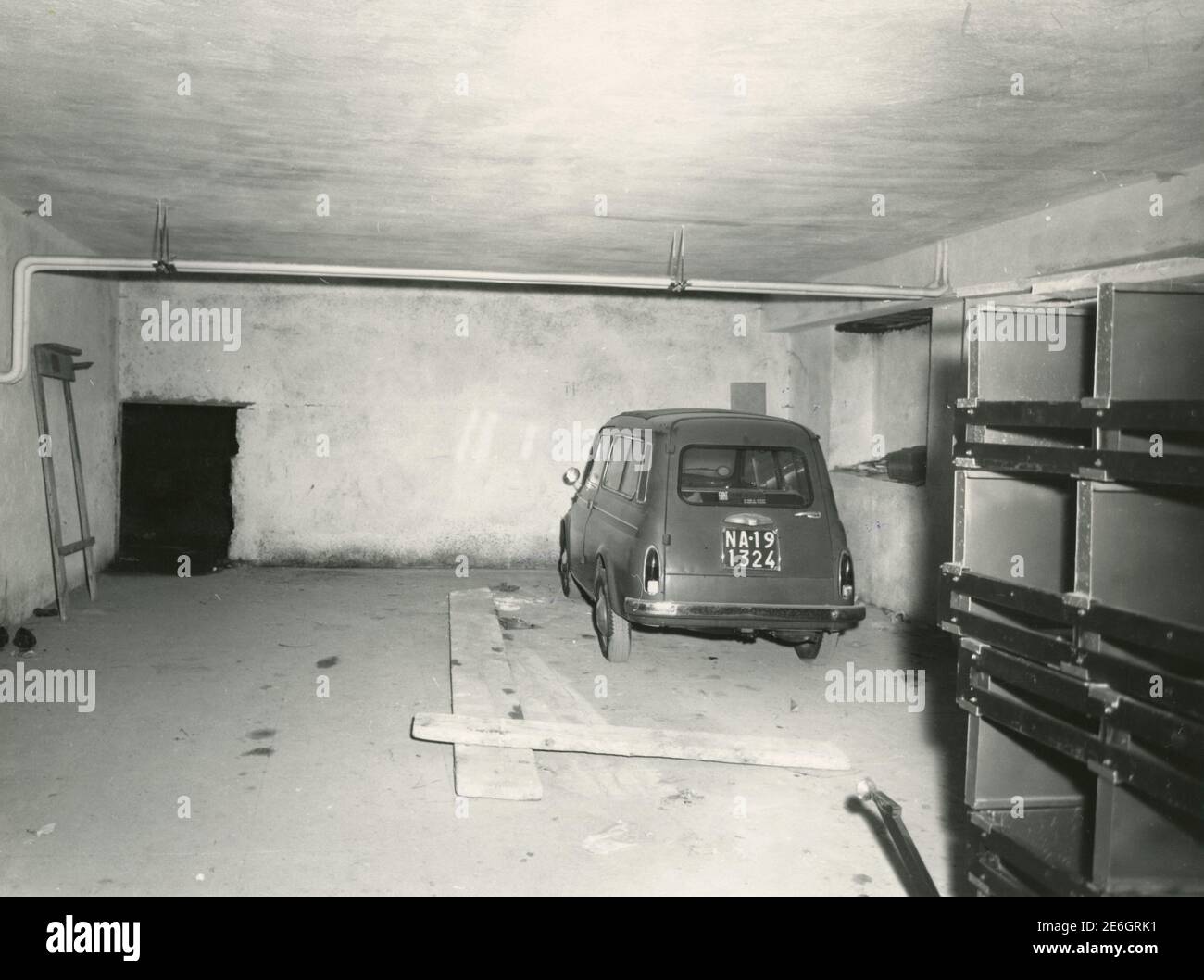 Garage with old car, Italy 1980s Stock Photo - Alamy