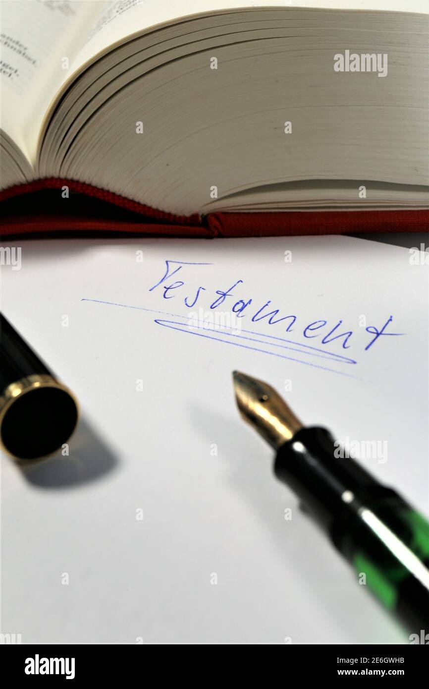 dictionary with a pen Stock Photo - Alamy