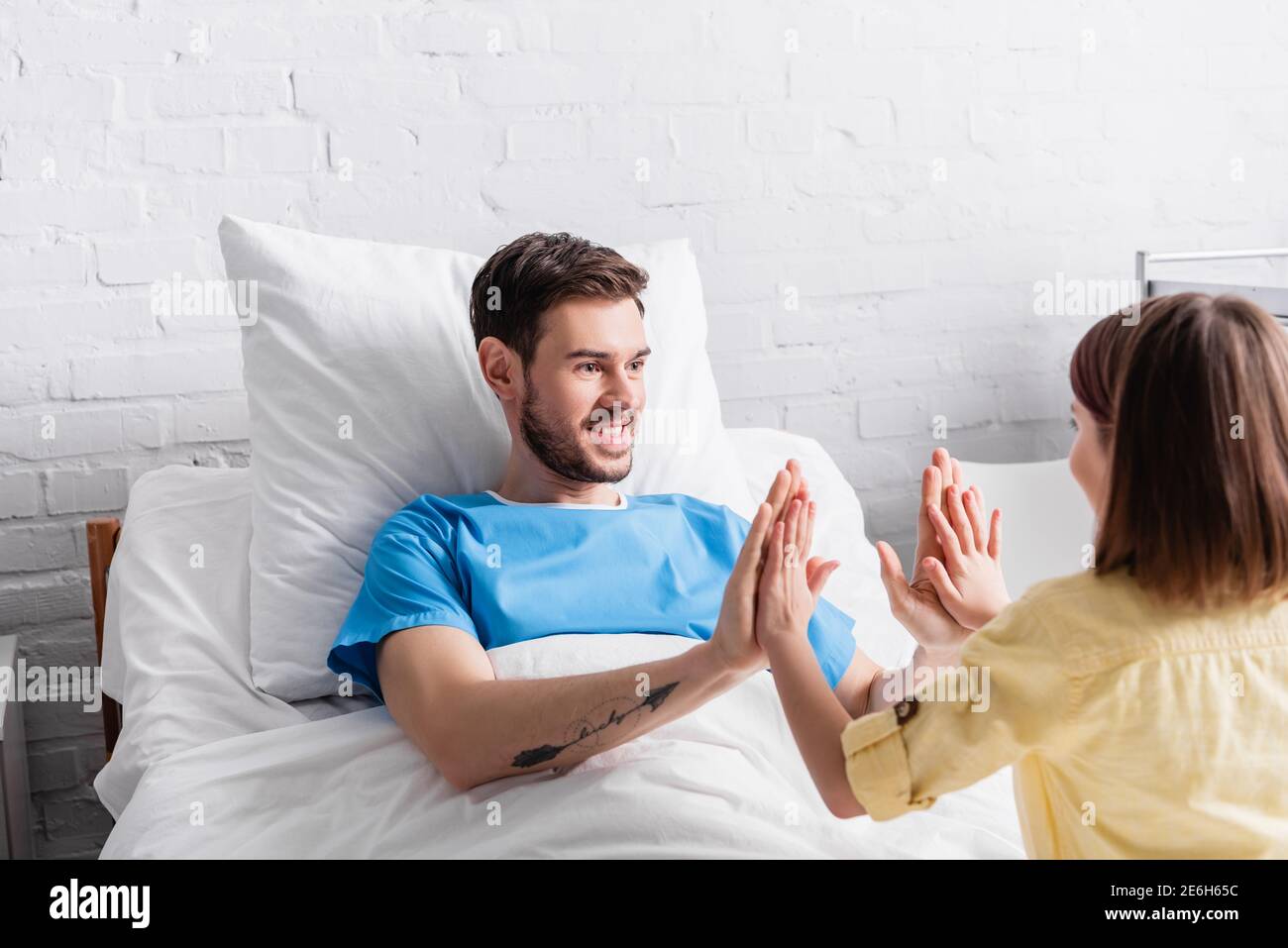happy father playing patty-cake game with daughter in hospital Stock ...