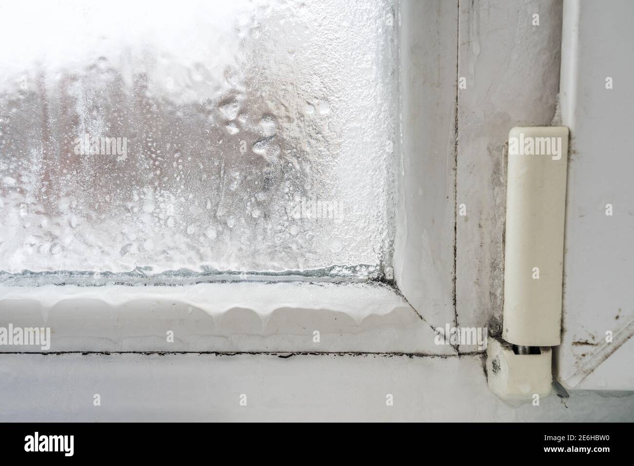 Close up of a defective plastic window with condensation and freezing ...