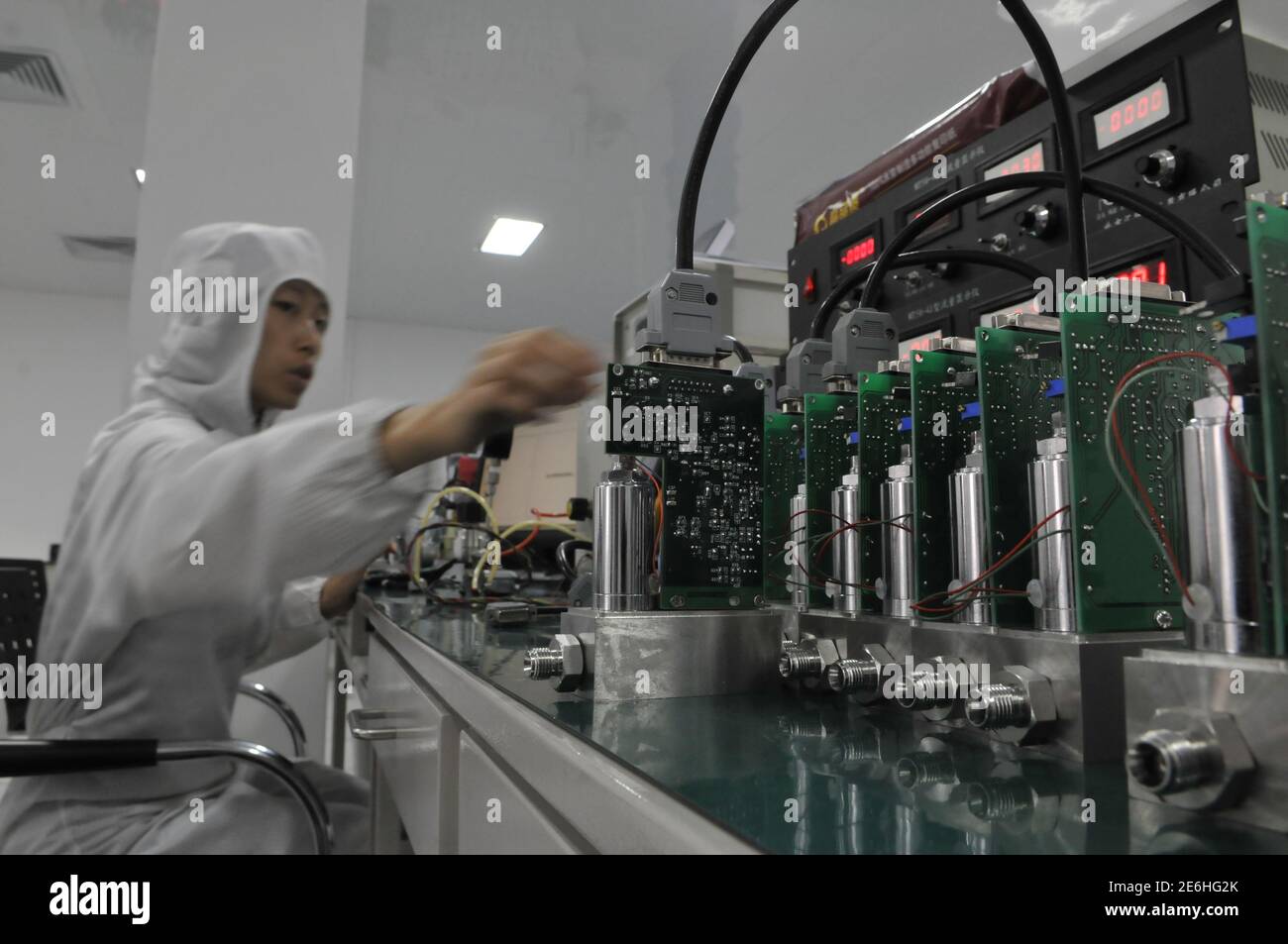 Workers are working in a factory where 70-nanometer memory modules are ...