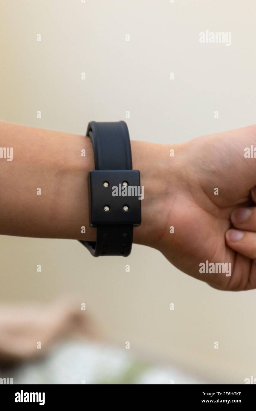 Back view of A COVID-19 positive tracking watch smart device for ...