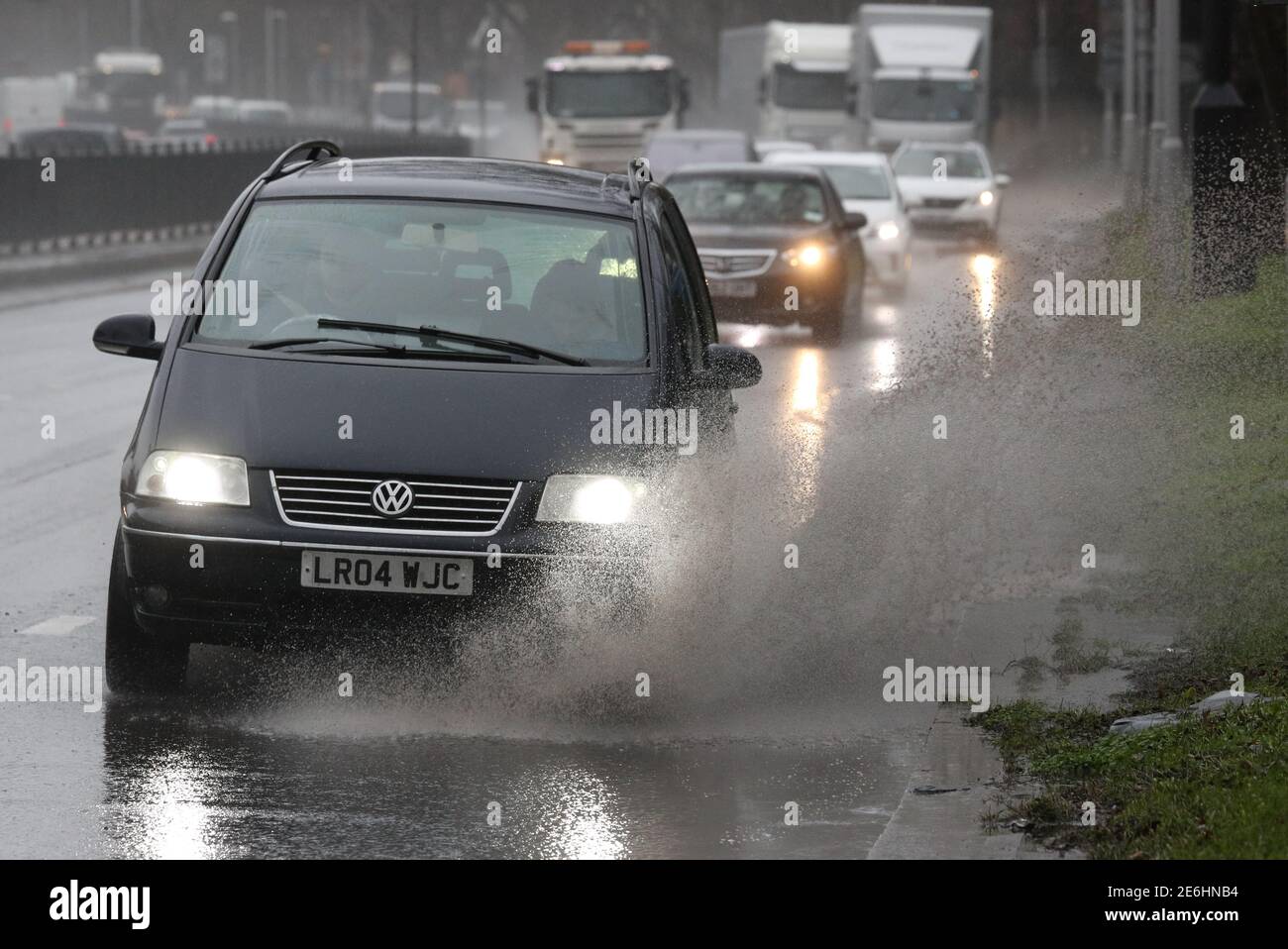 Car going through a puddle hi-res stock photography and images - Alamy