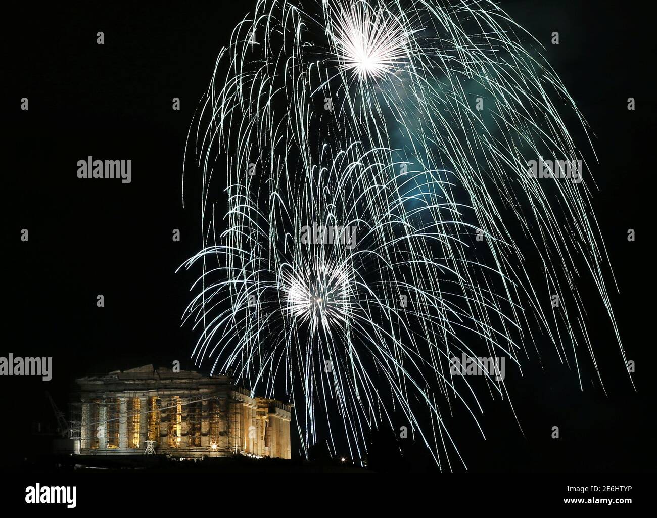 Fireworks explode over the ancient parthenon temple at the acropolis hi ...