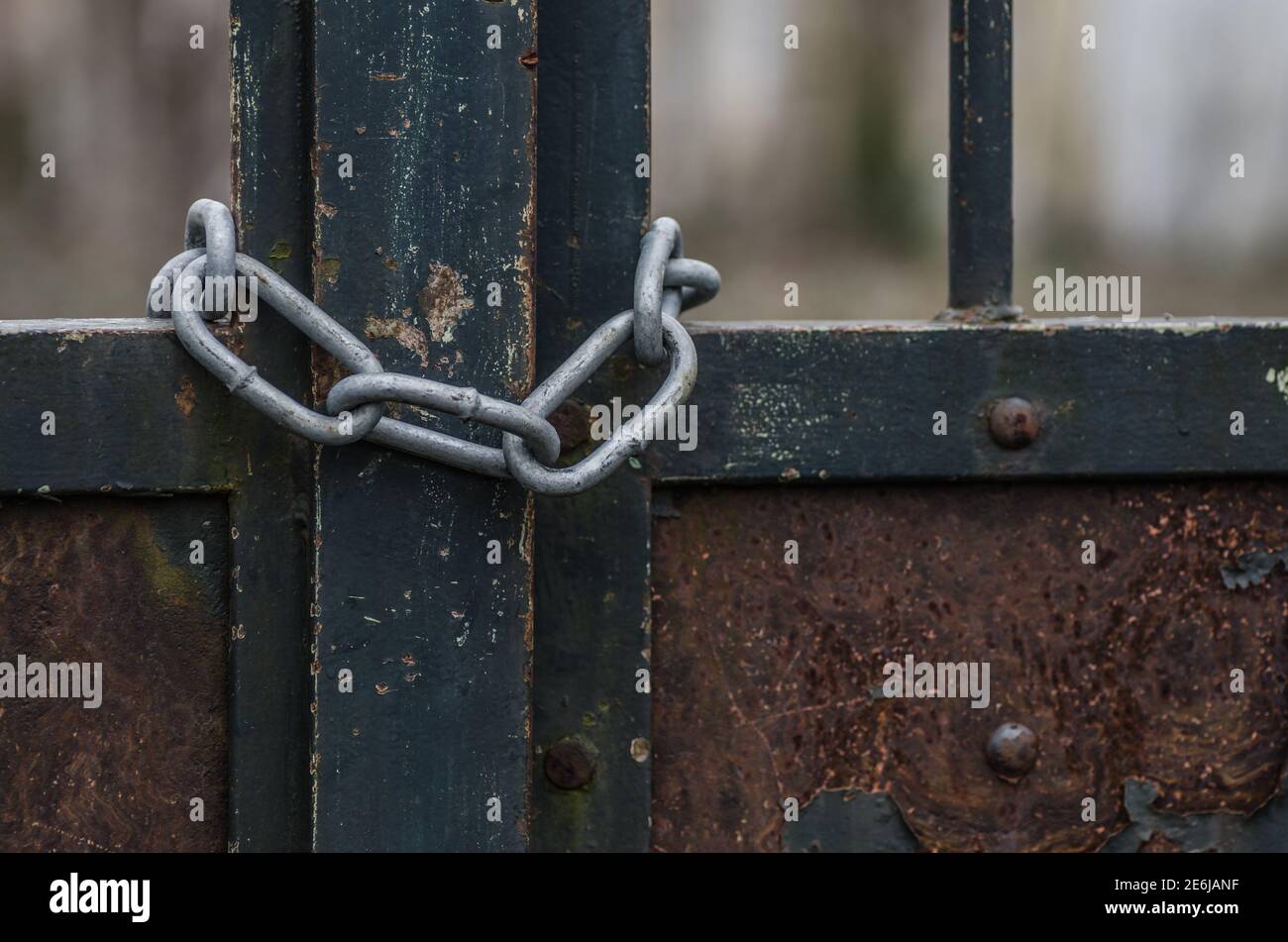 thick chain around a blocked gate Stock Photo - Alamy