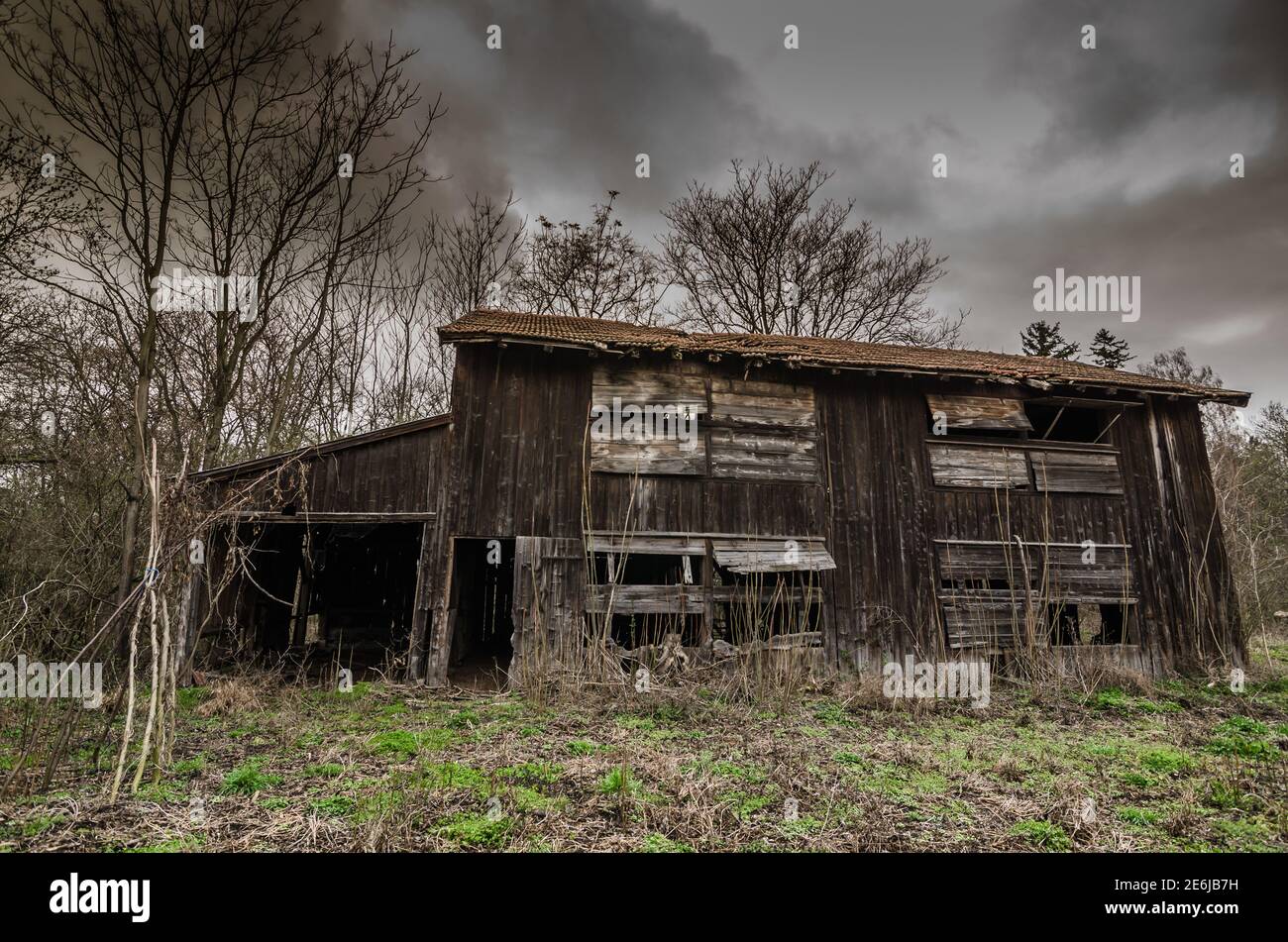 abandoned old wood barn with rain clouds Stock Photo - Alamy